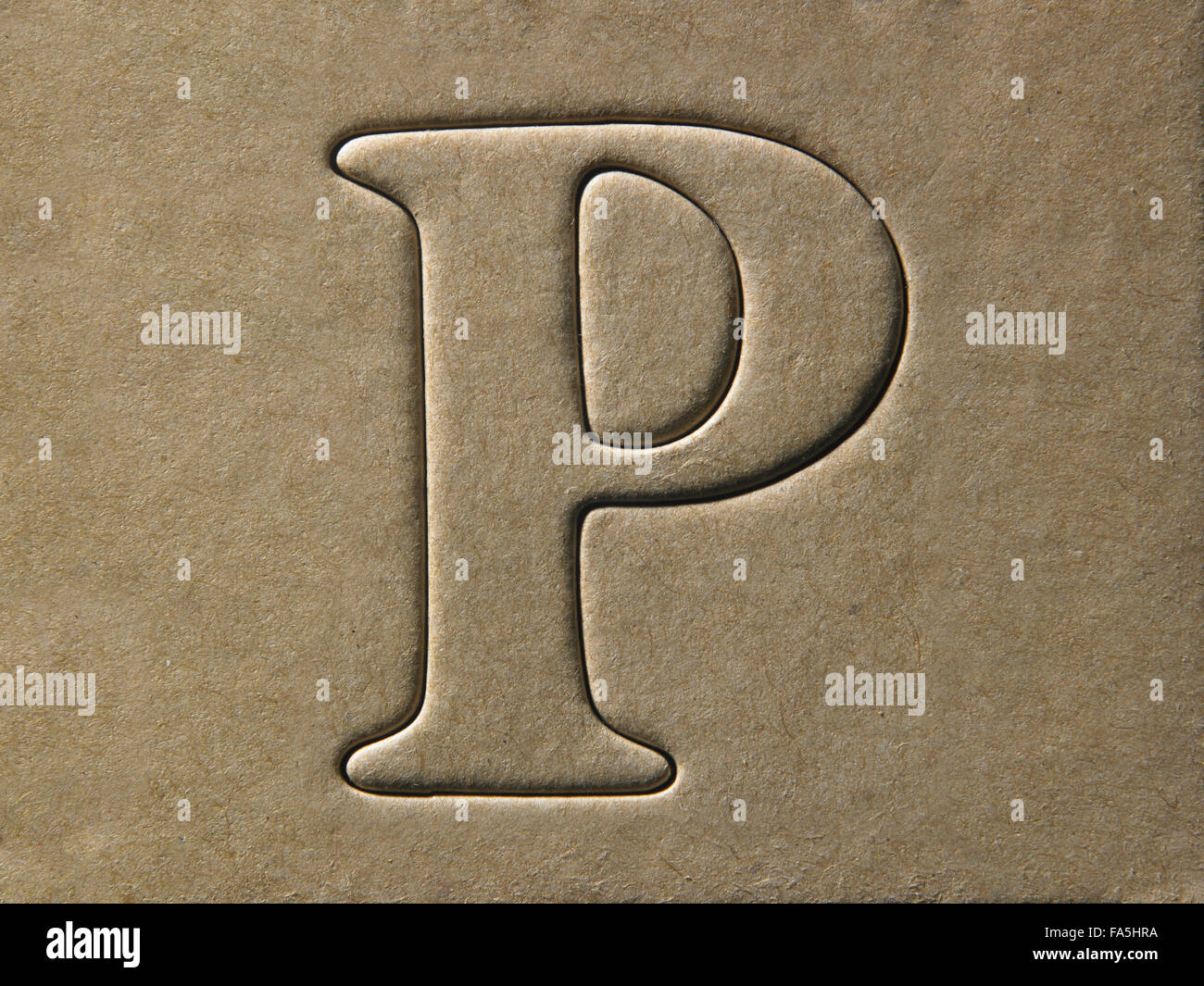 die cut alphabet p on the brown card board Stock Photo - Alamy