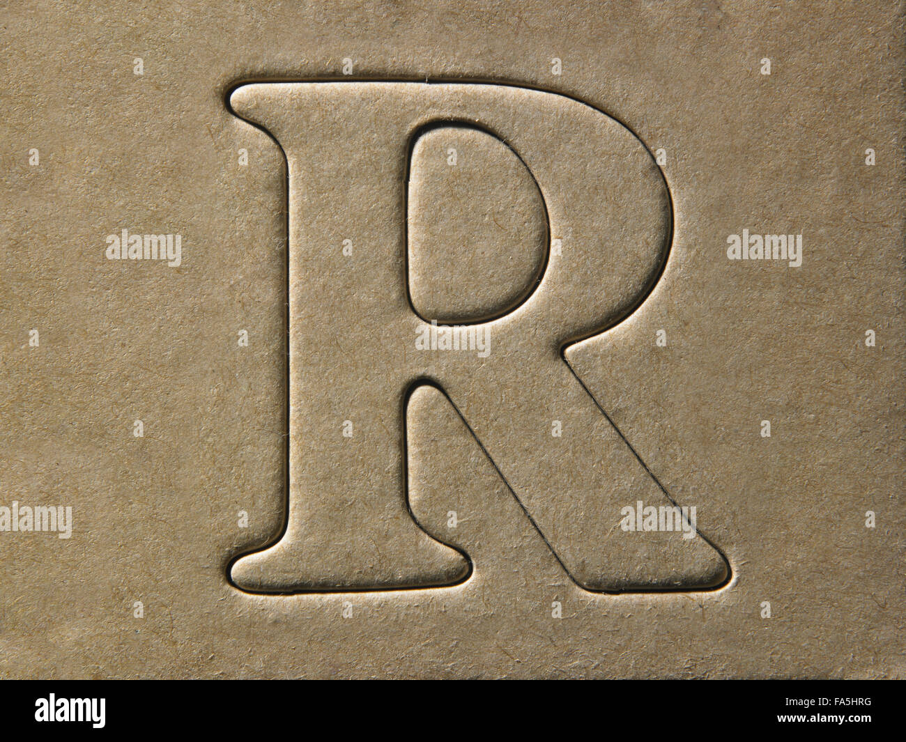 die cut alphabet r on the brown card board Stock Photo - Alamy