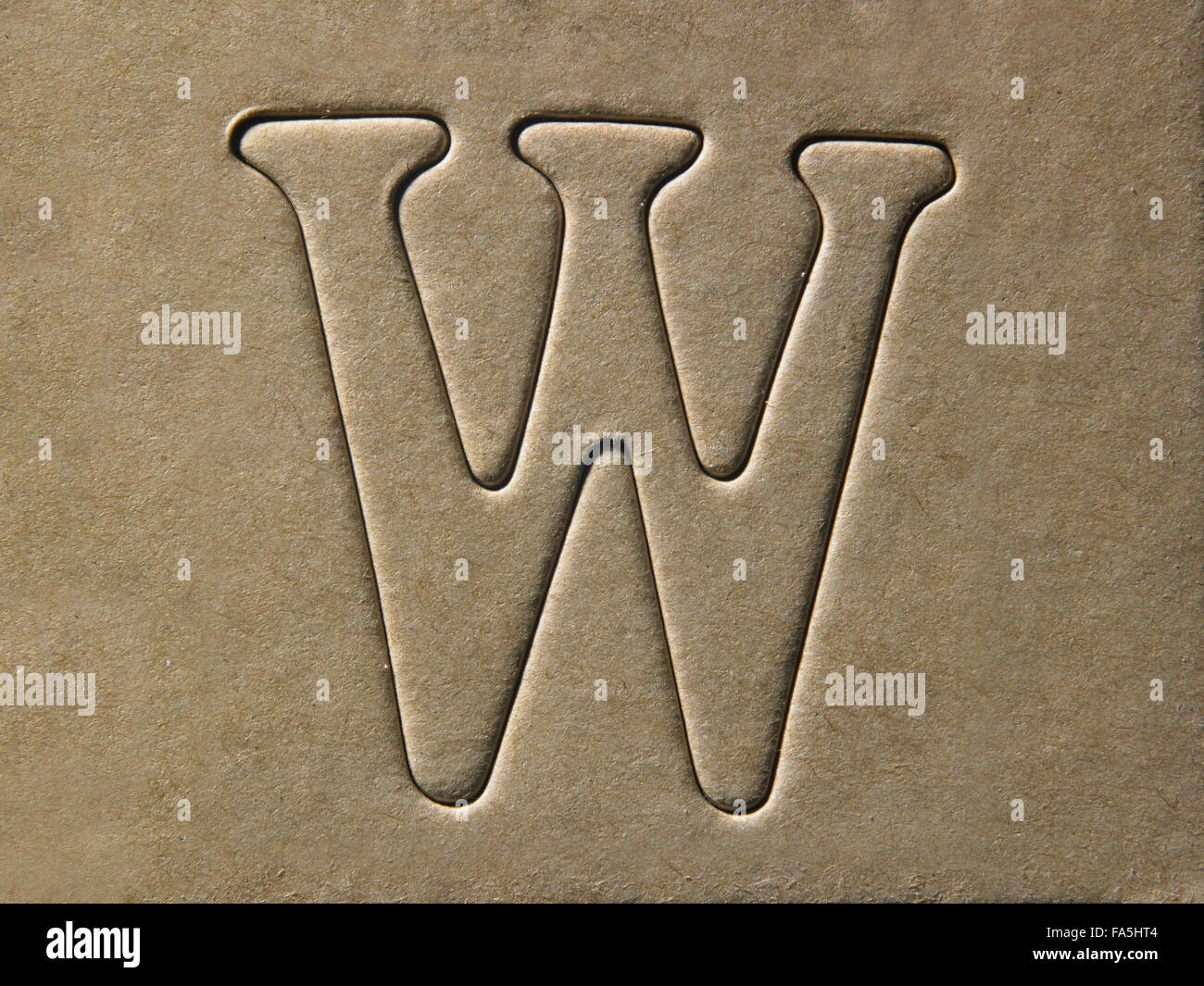 die cut alphabet w on the brown card board Stock Photo - Alamy