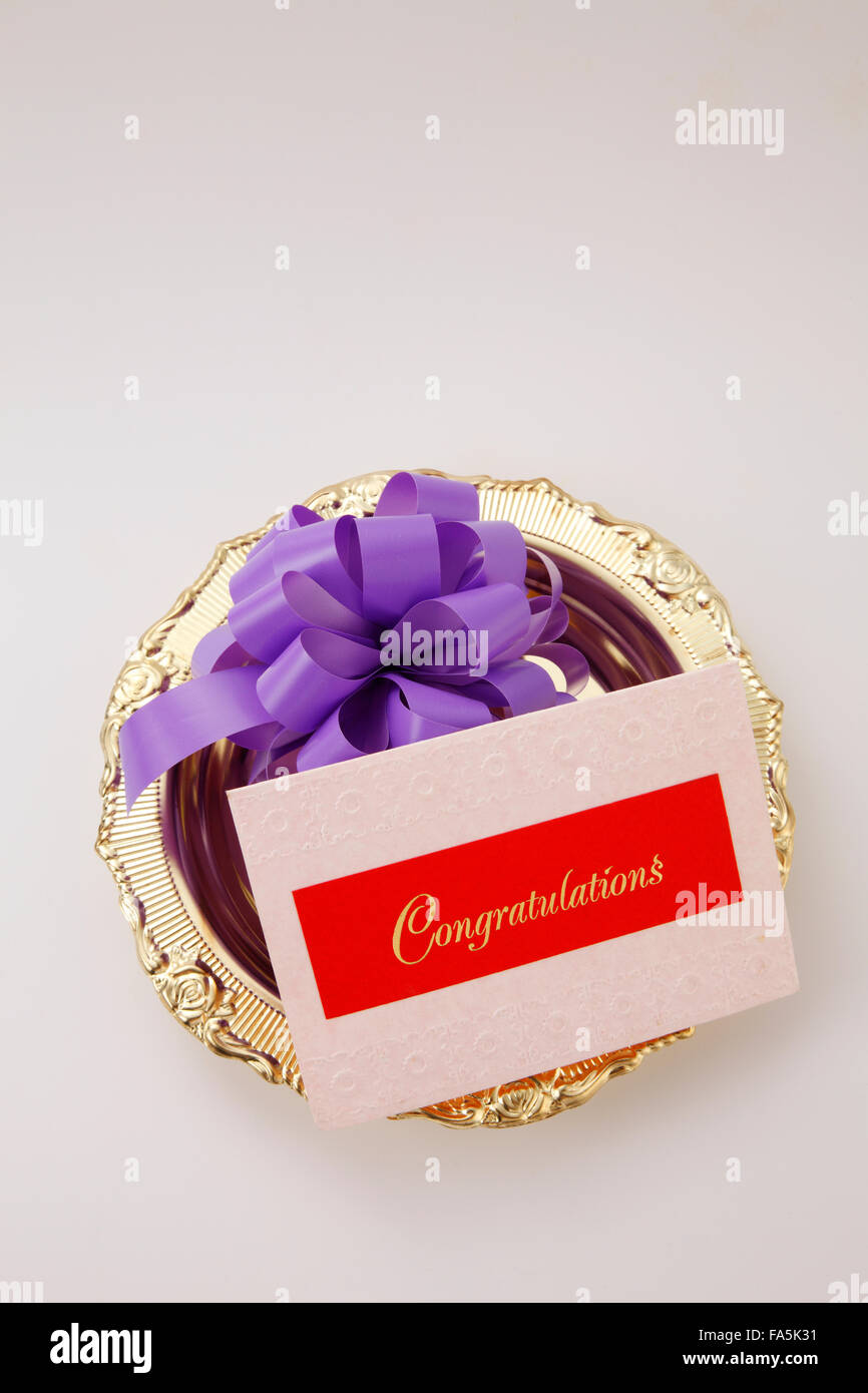 top view purple ribbon bow and a congraturation card Stock Photo - Alamy