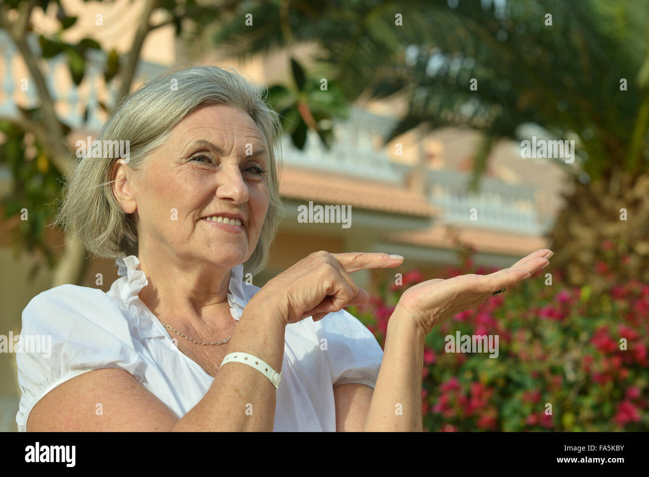Older woman pointing Stock Photo - Alamy