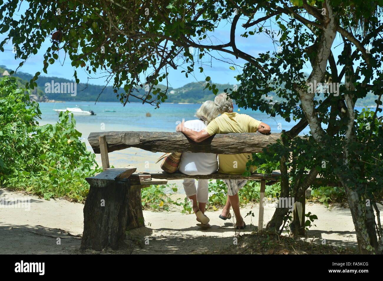 Elderly couple rest at tropical resort Stock Photo - Alamy