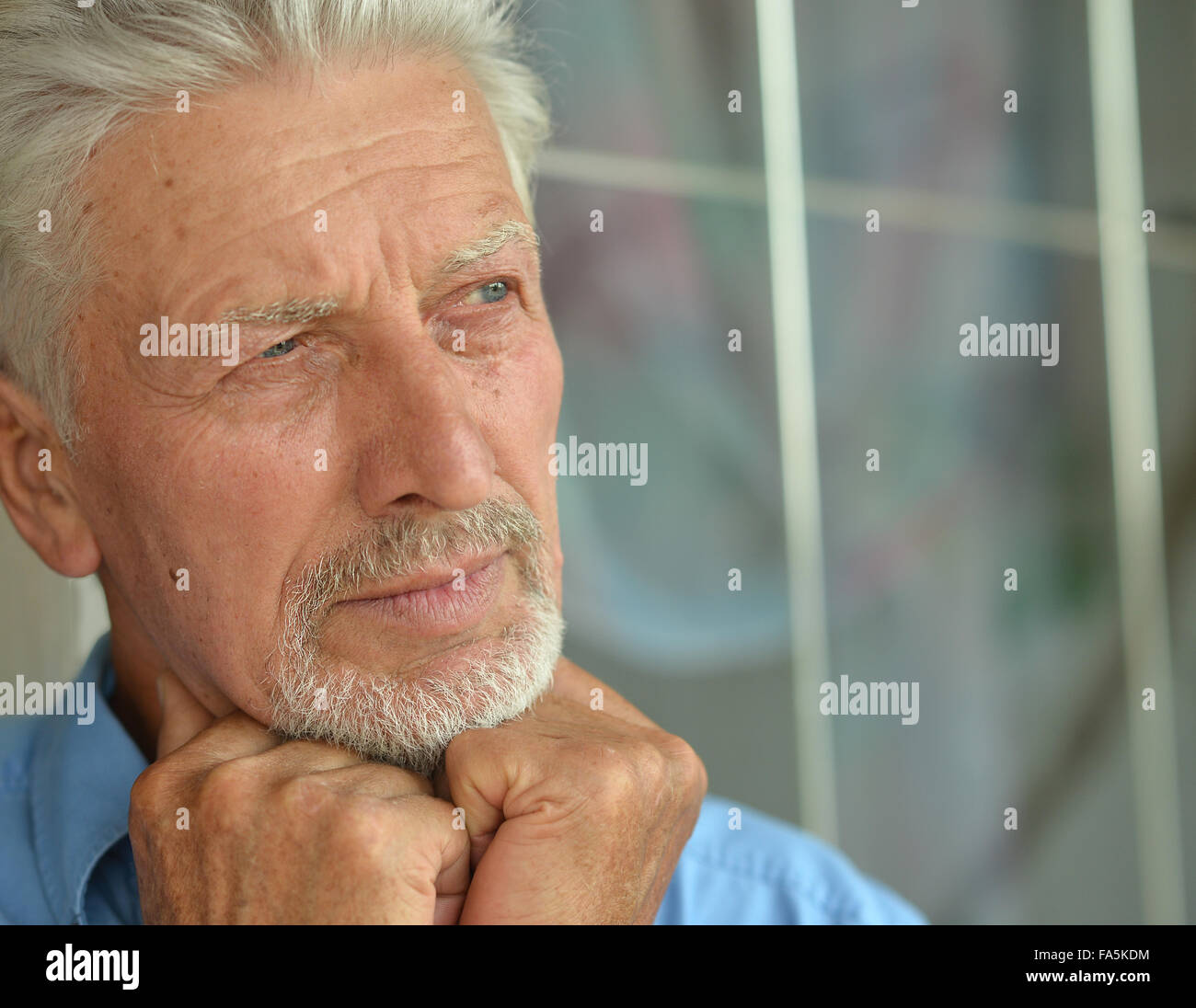 Sad senior man at home Stock Photo - Alamy