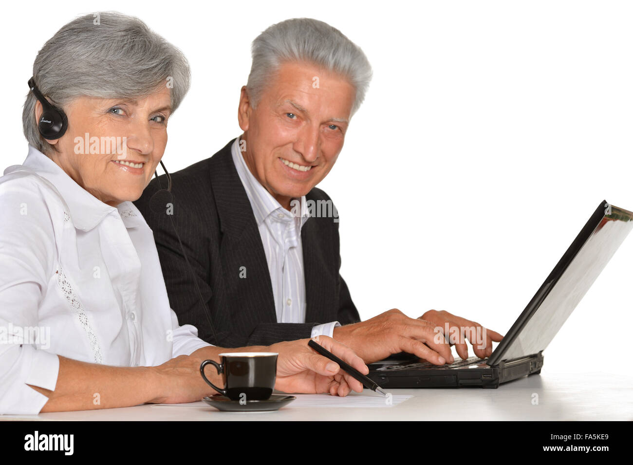 Elderly people working with laptop Stock Photo - Alamy