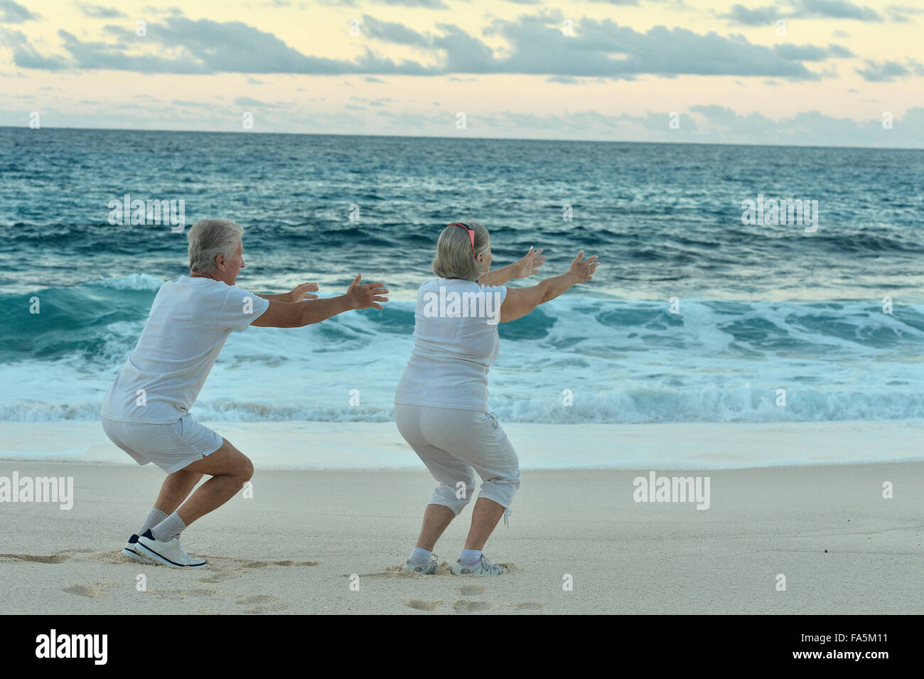 Senior couple exercising in summer Stock Photo - Alamy