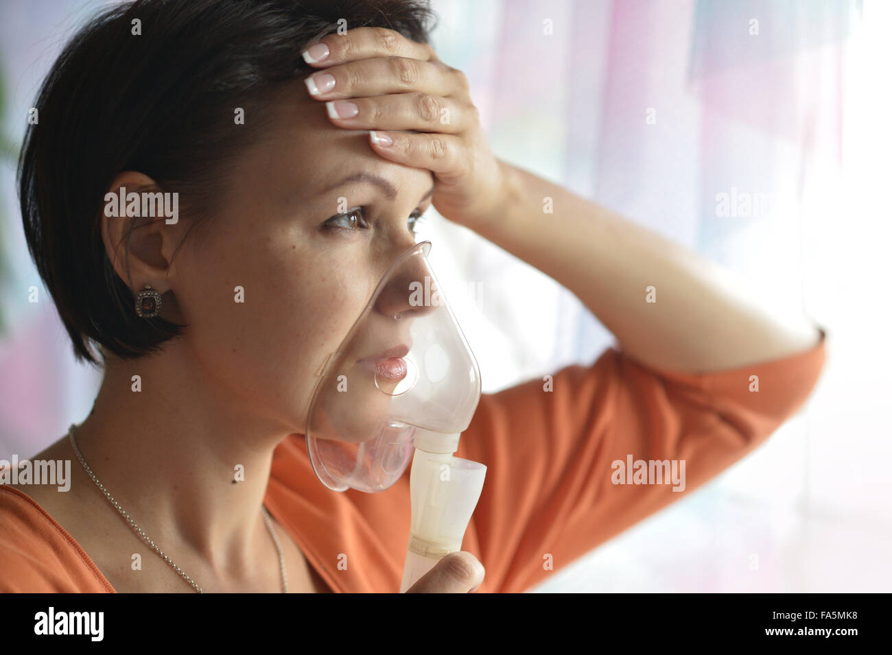 Young woman doing inhalation Stock Photo - Alamy