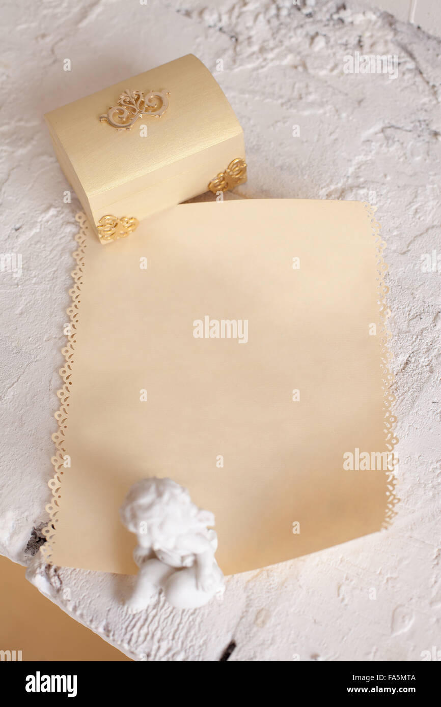 wedding invitation on parchment with a casket and a figure of an angel ...