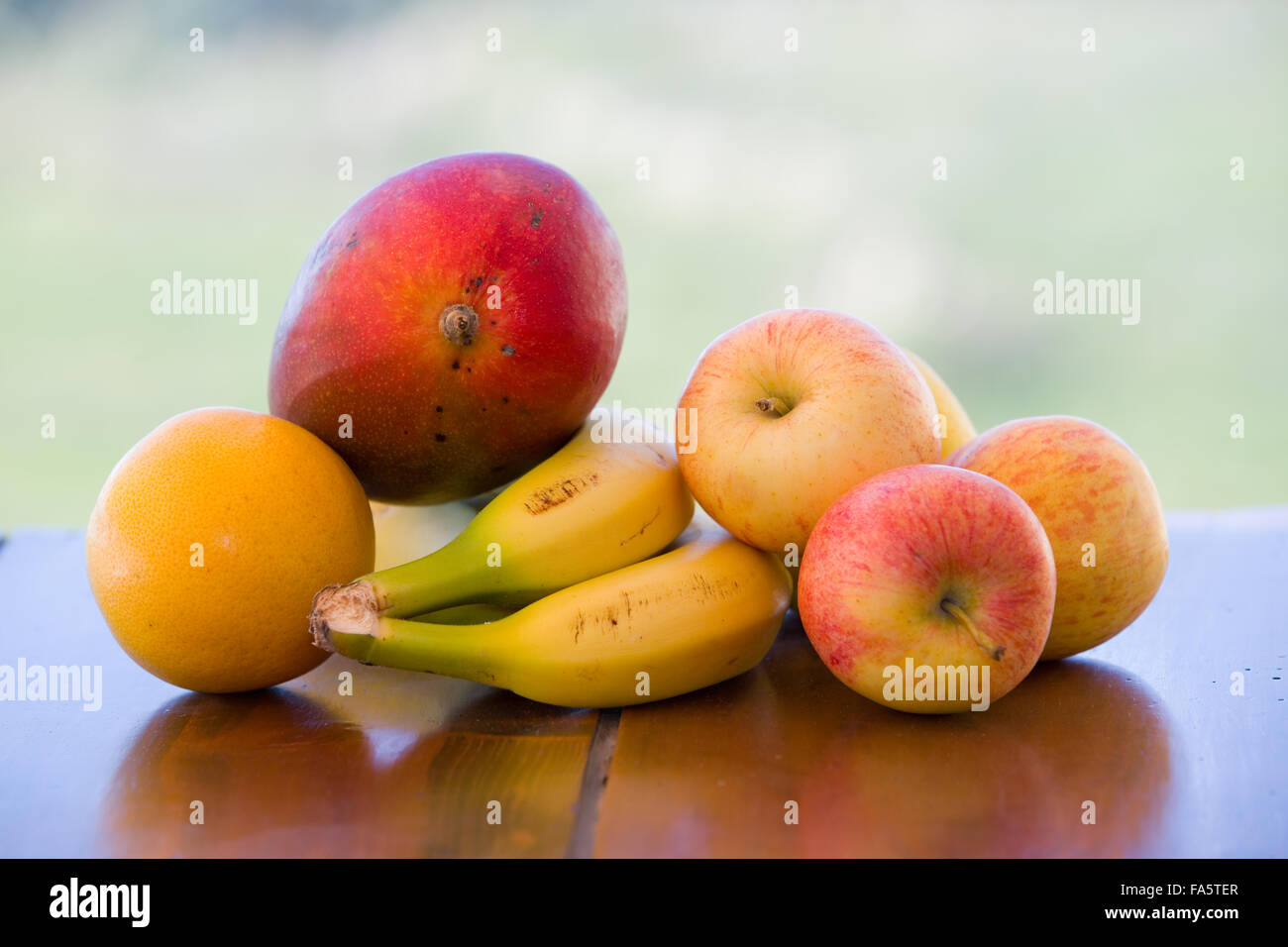 variety of fruits on table in the garden Stock Photo - Alamy