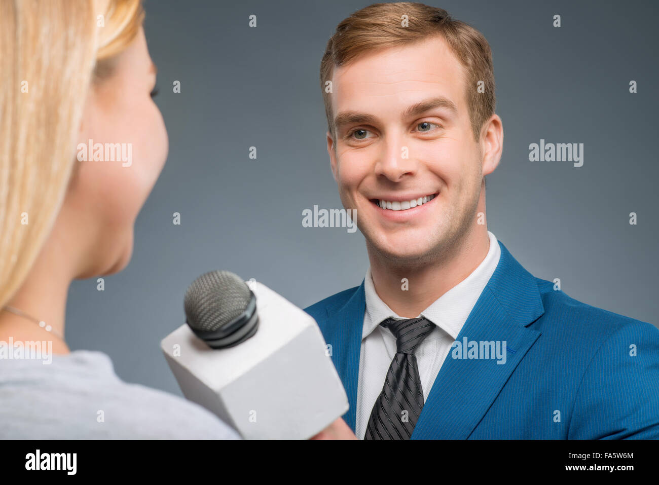 Female reporter taking interview hi-res stock photography and images ...