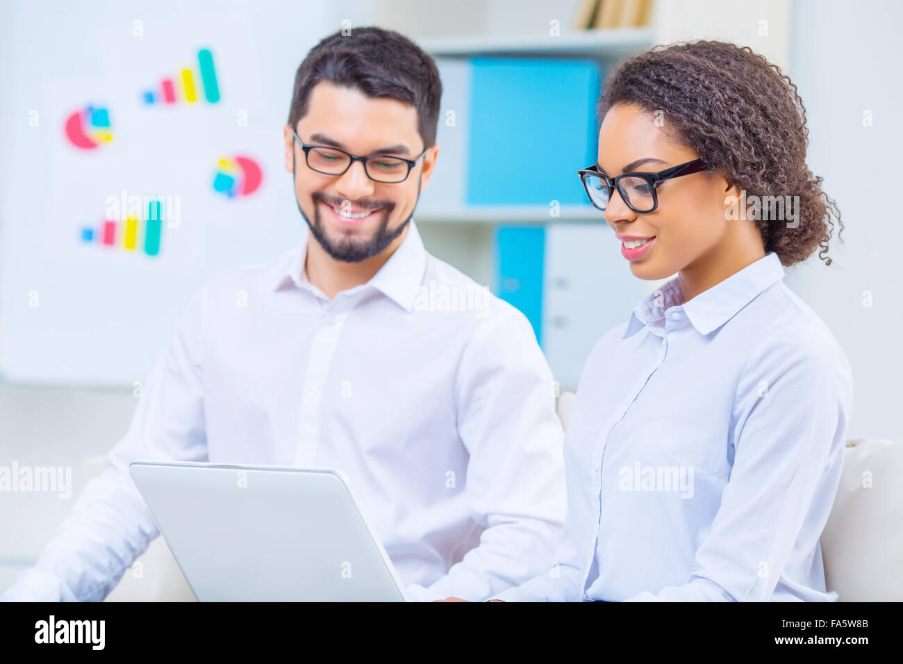 Two colleagues are busy with project Stock Photo - Alamy