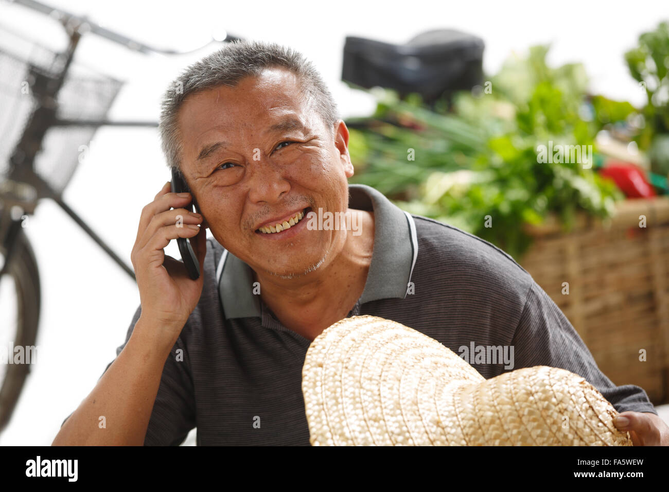 Farmers make a phone call Stock Photo - Alamy