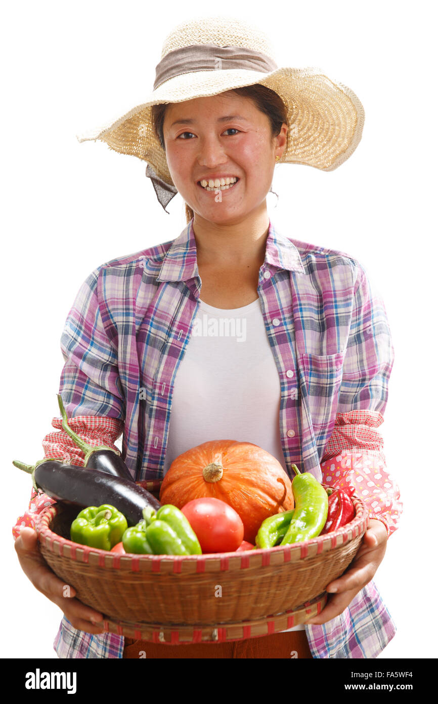 Farmers take a basket of vegetables Stock Photo - Alamy