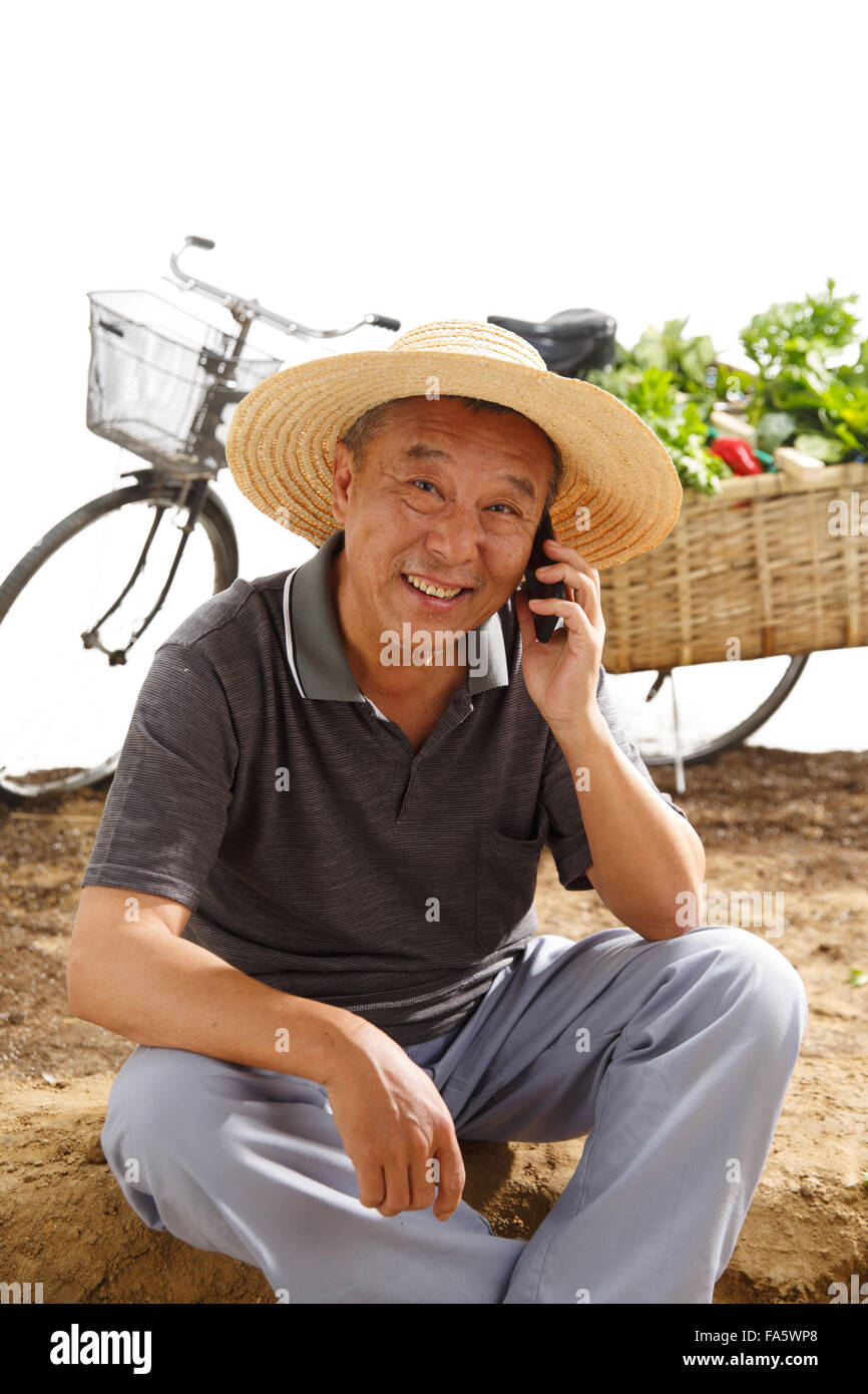 Farmers make a phone call Stock Photo - Alamy