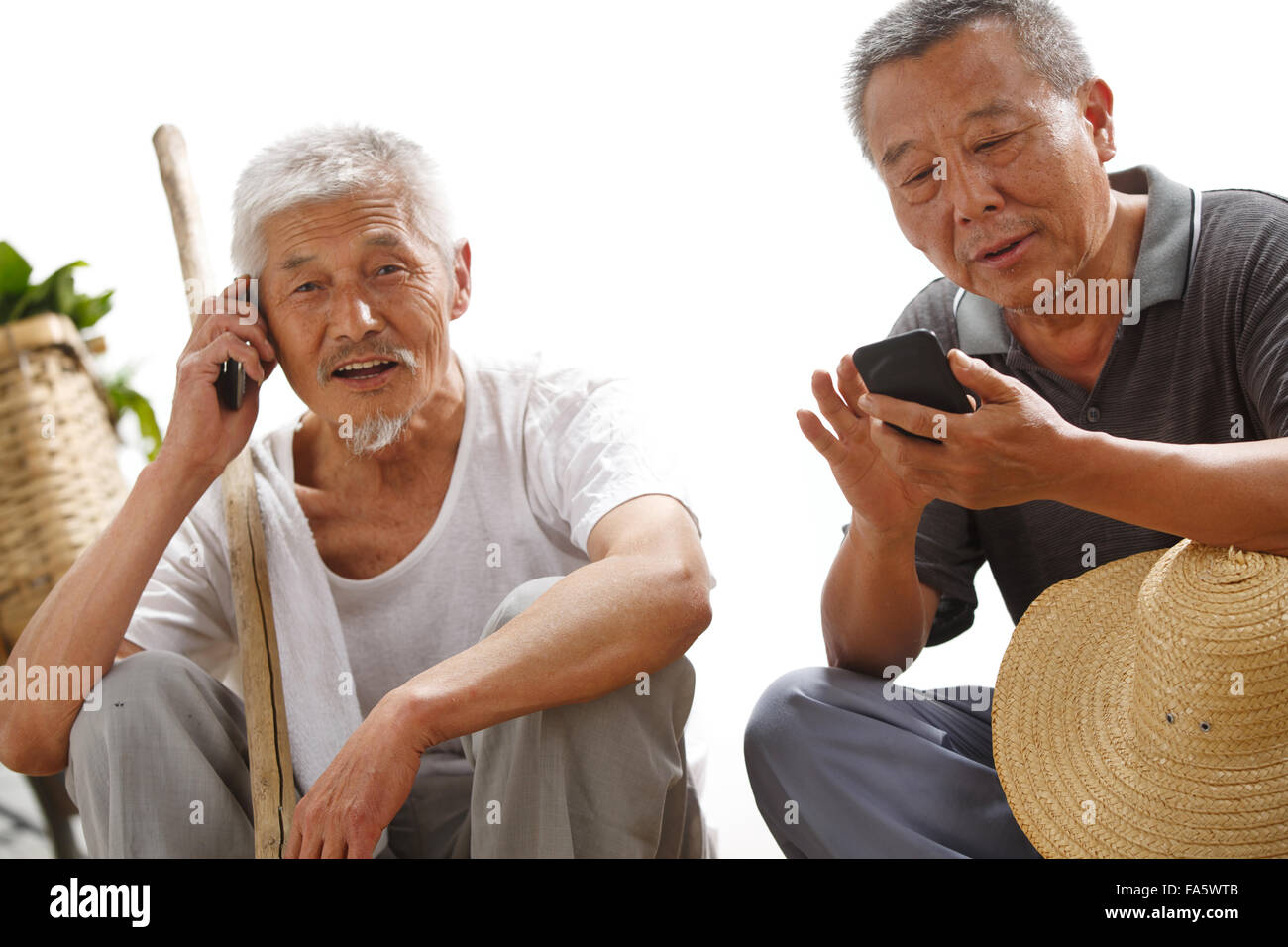 Farmers make a phone call Stock Photo - Alamy