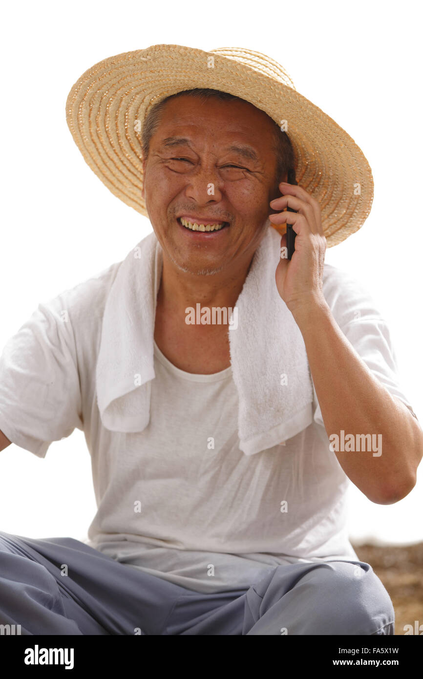 Farmers make a phone call Stock Photo - Alamy