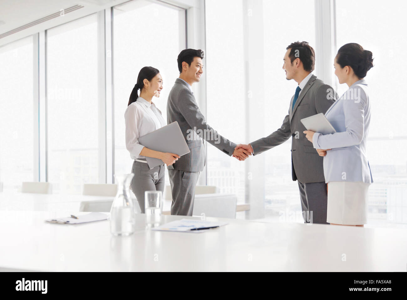Business handshake cooperation Stock Photo - Alamy