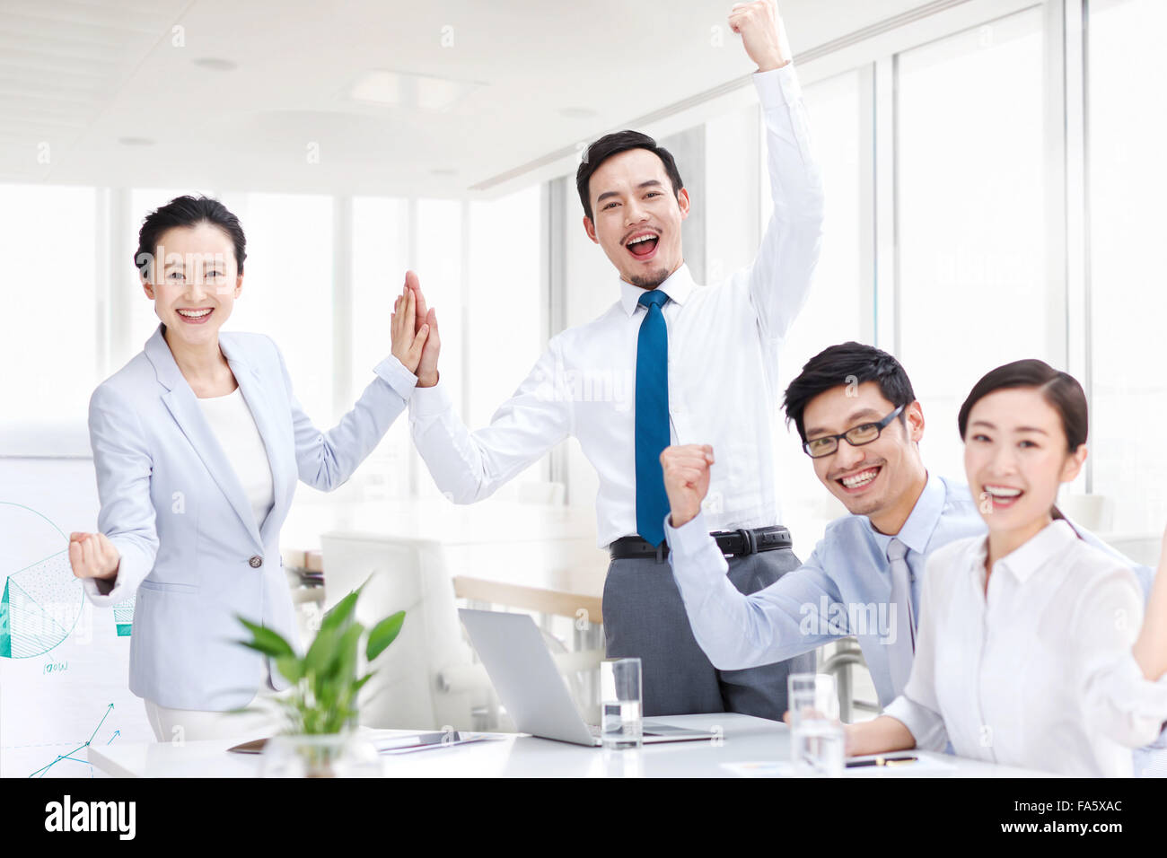 Business team in conference room cheers Stock Photo - Alamy