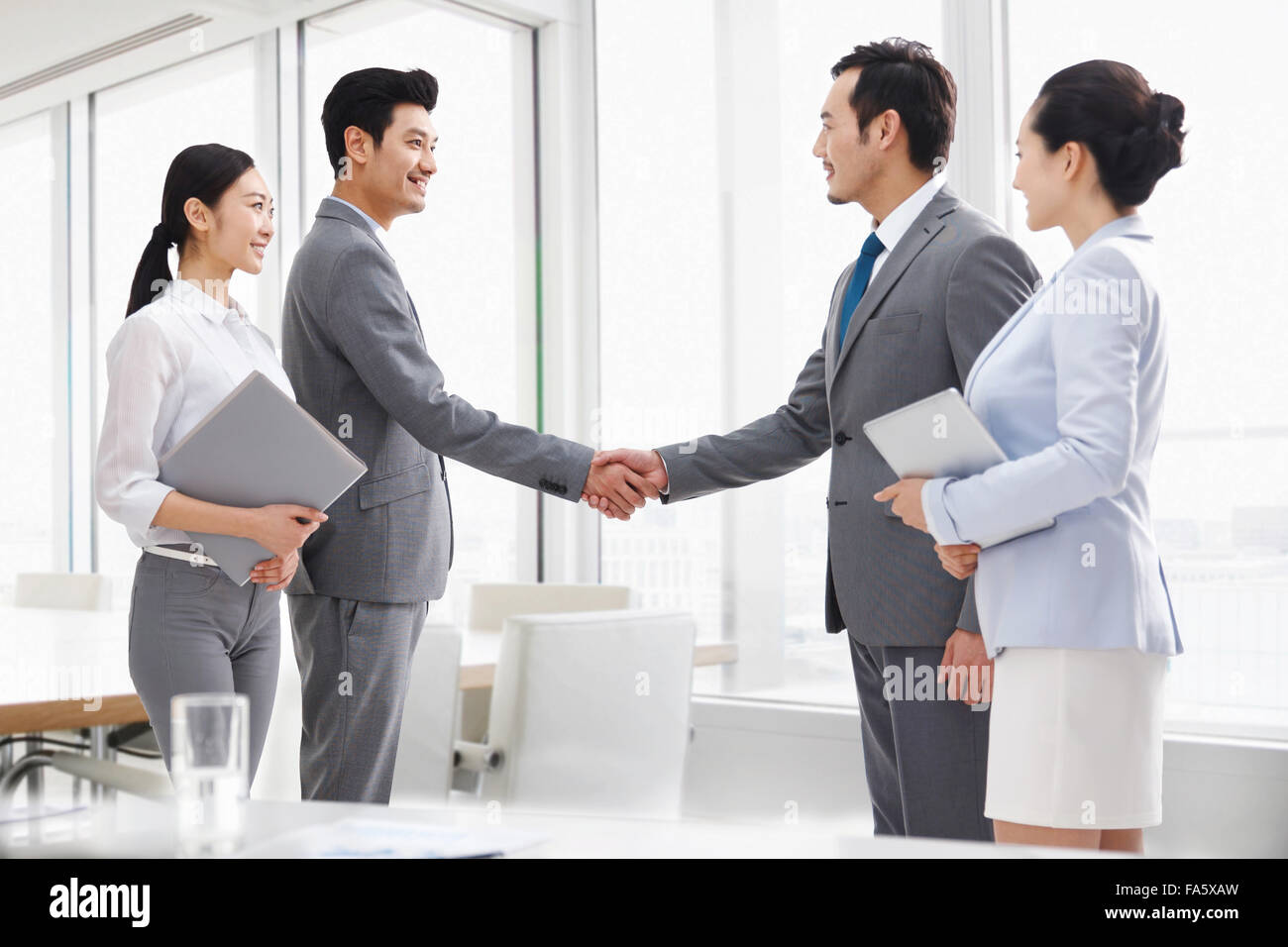 Corporate handshake asian indian hi-res stock photography and images ...