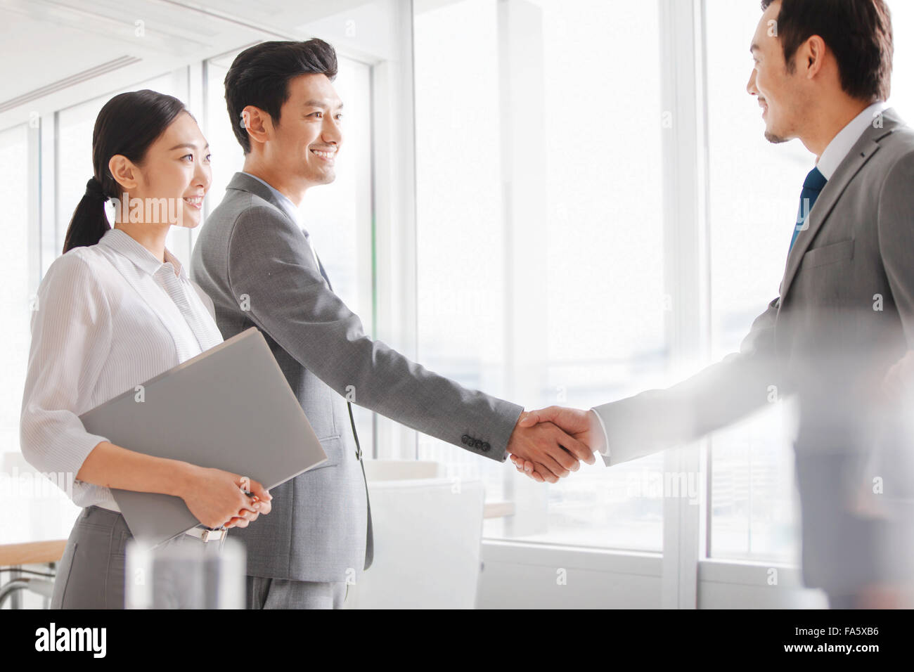 Business people shake hands Stock Photo - Alamy