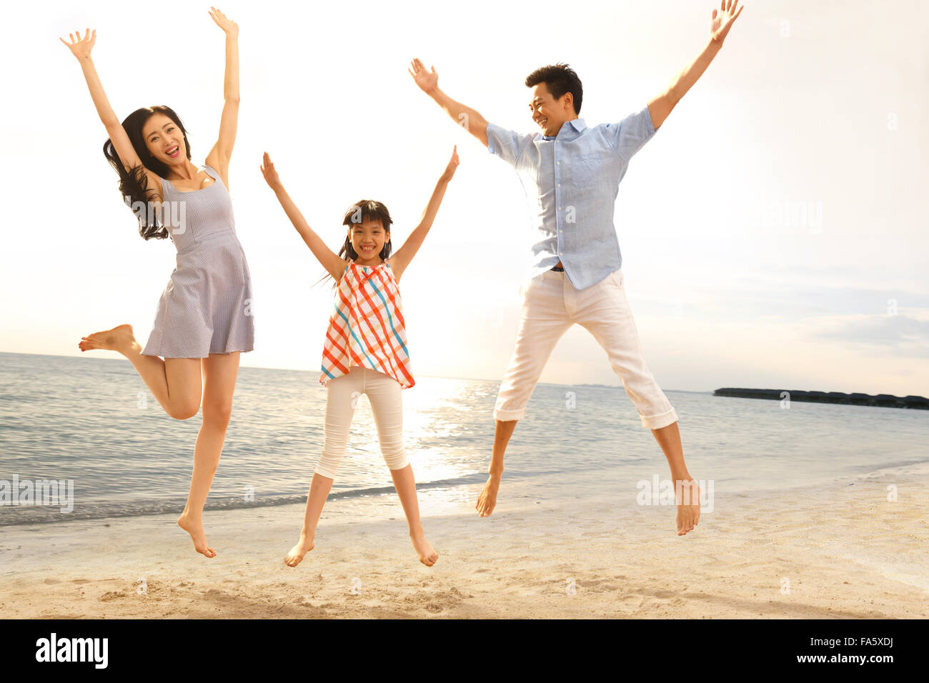 Family jumping hi-res stock photography and images - Alamy