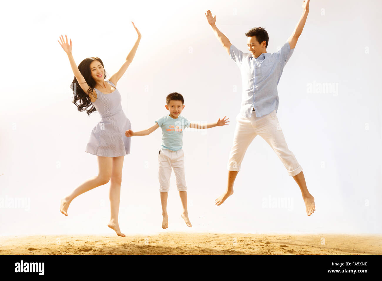 Family jumping hi-res stock photography and images - Alamy