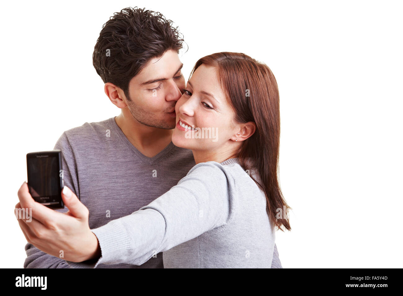 Happy smiling couple taking self portraits with a cell phone Stock ...