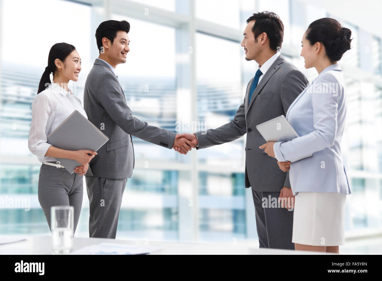 Business people shake hands Stock Photo - Alamy