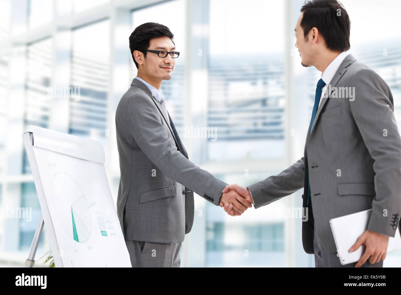 Business men shake hands Stock Photo - Alamy