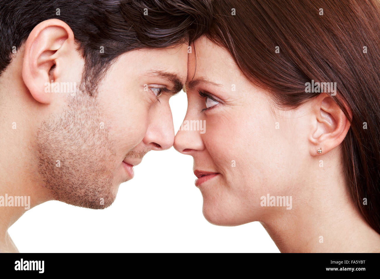 Happy couple in love looking deeply into each others eyes Stock Photo ...