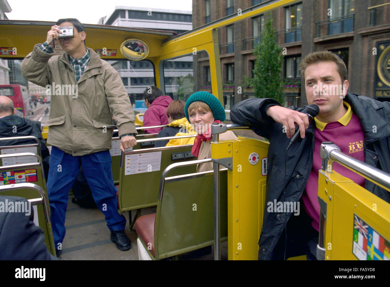 PICTURE SHOWS TOURISTS ABOARD 'THE RED TOUR' , RUN BY 'THE BIG BUS ...