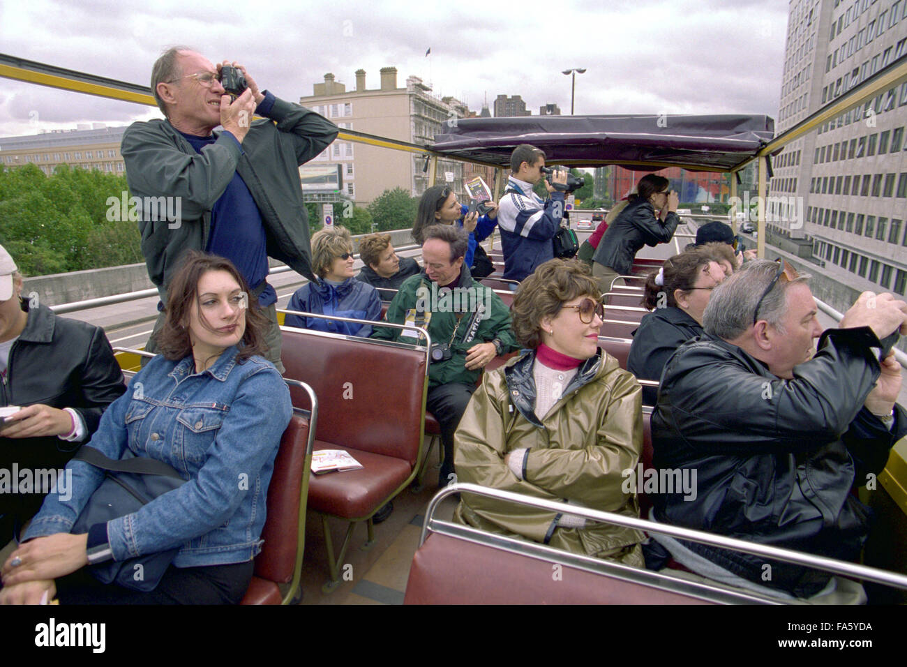 PICTURE SHOWS TOURISTS ABOARD 'THE RED TOUR' , RUN BY 'THE BIG BUS ...