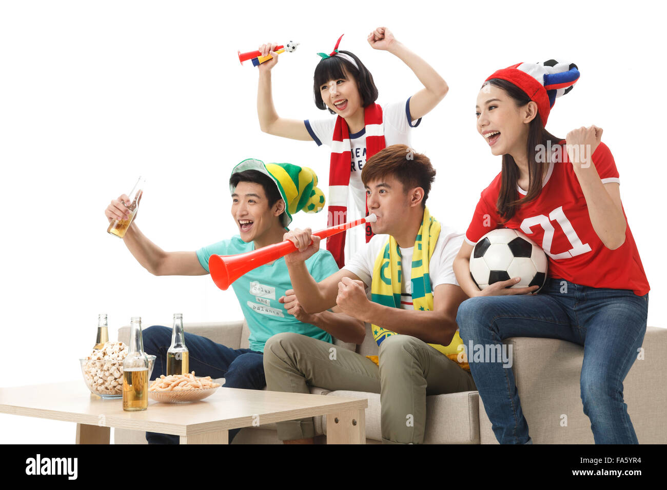 Young fans watching the game cheering Stock Photo - Alamy