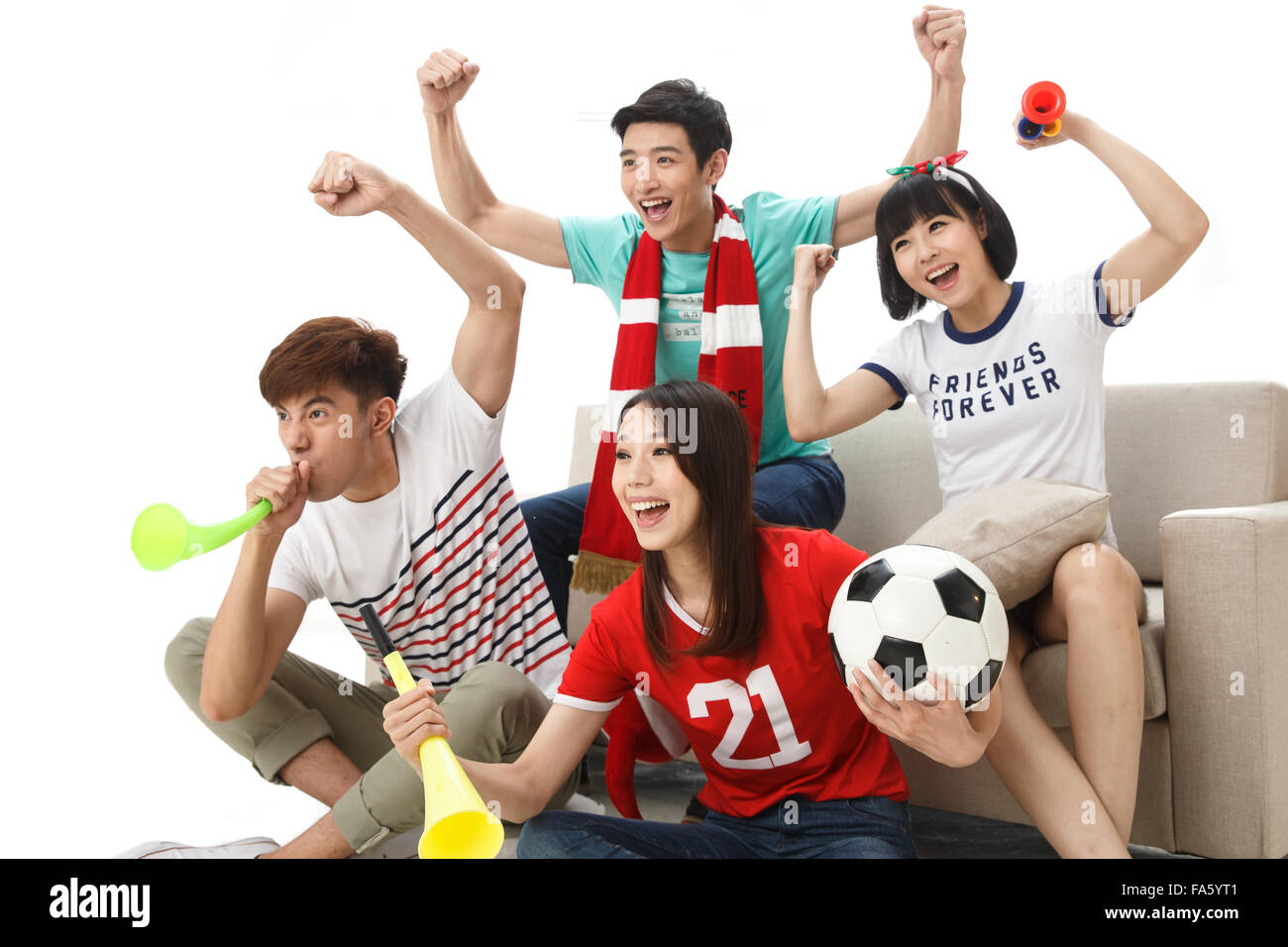 Young fans watching the game cheering Stock Photo - Alamy