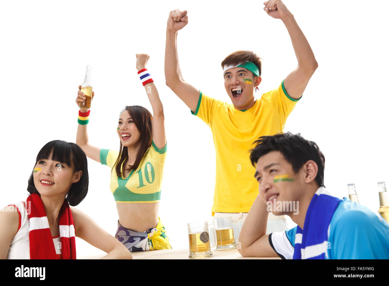 Young fans watching the game cheering Stock Photo - Alamy