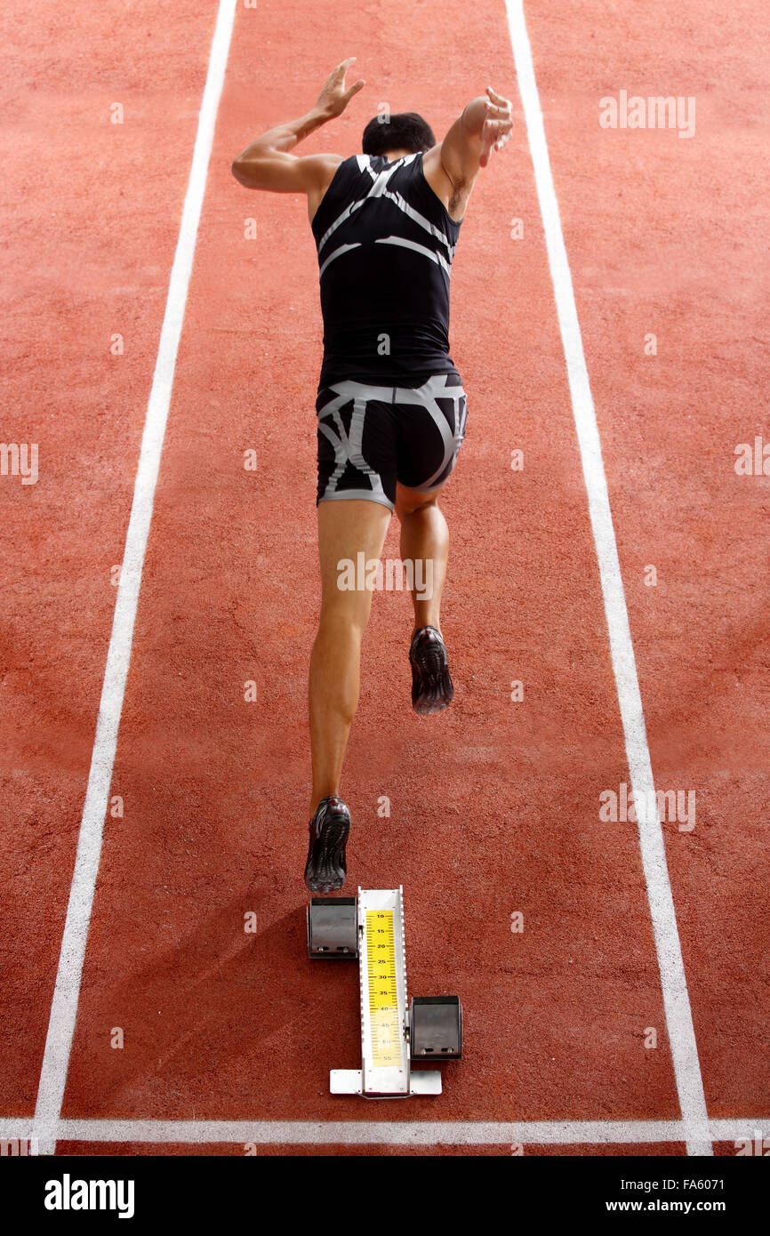Male track and field athlete running Stock Photo - Alamy