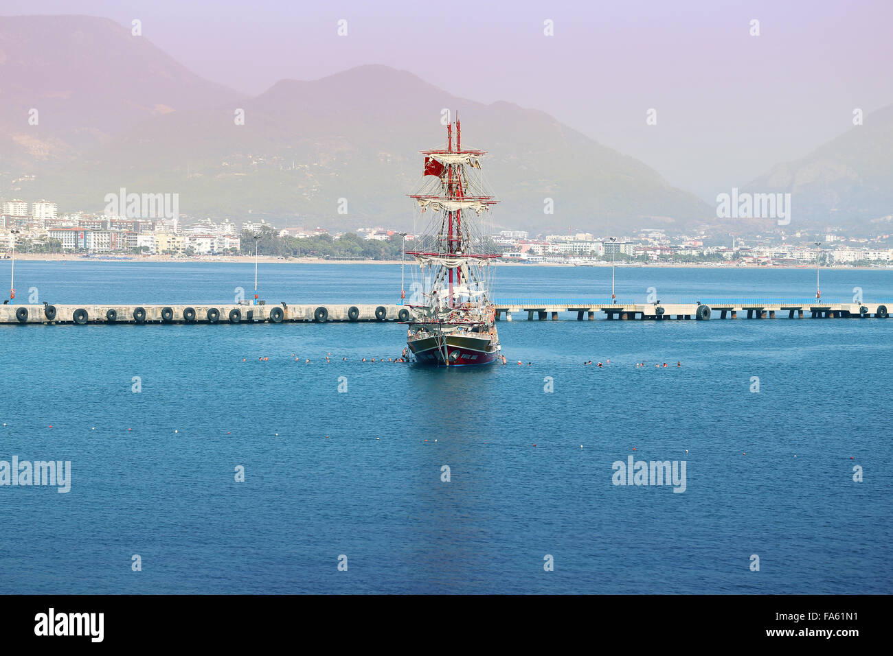 Beautiful ship in the sea Bay on background of mountains Stock Photo ...