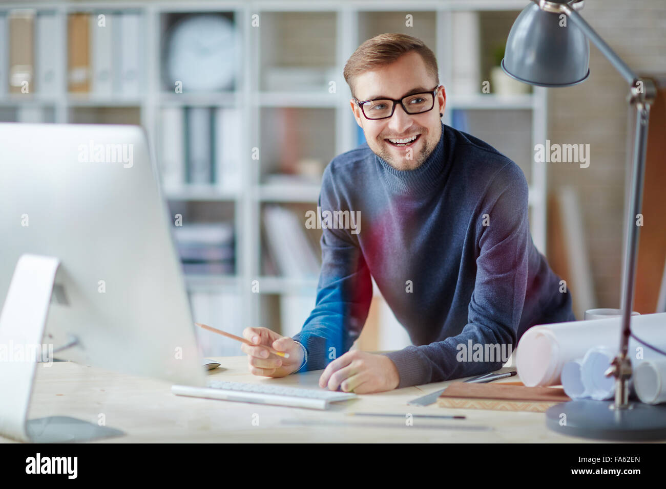 Happy engineer at workplace Stock Photo - Alamy