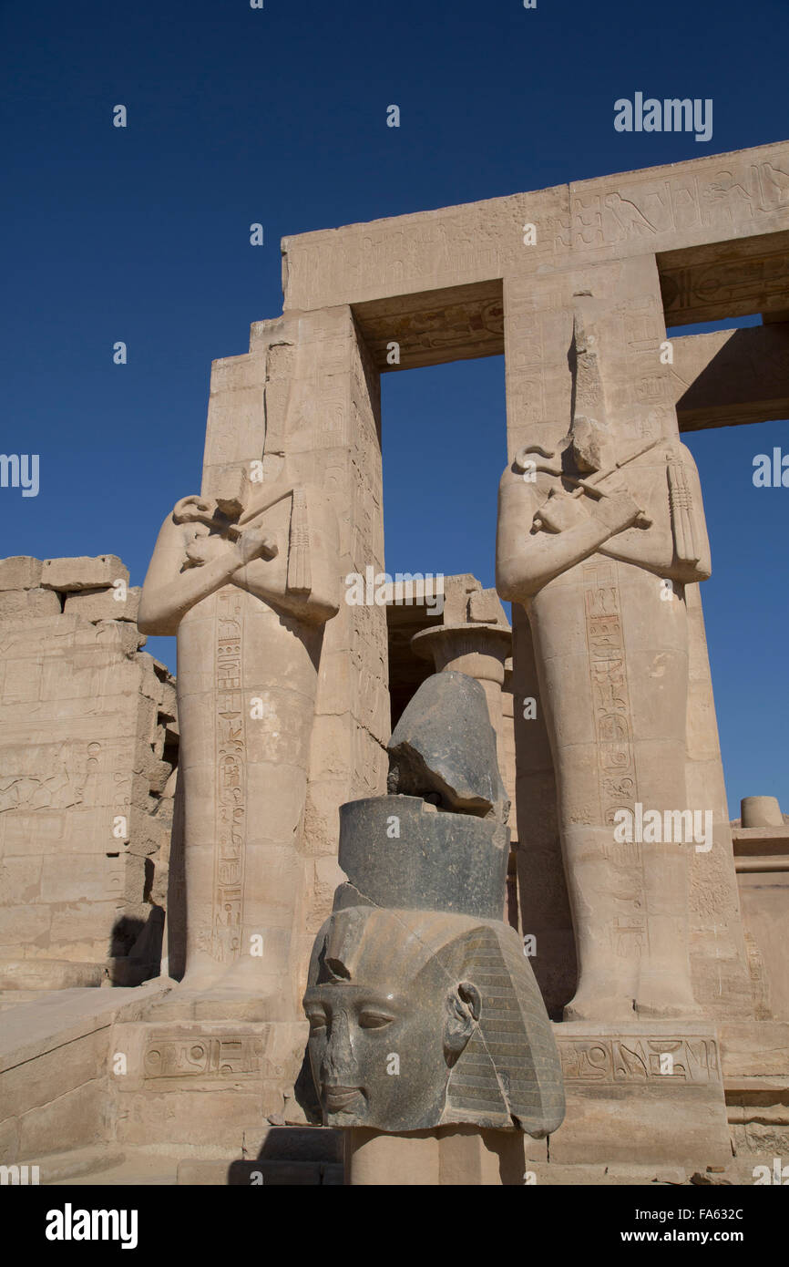 Bust of Ramses II (foreground), Statues of Osiris (background), The ...