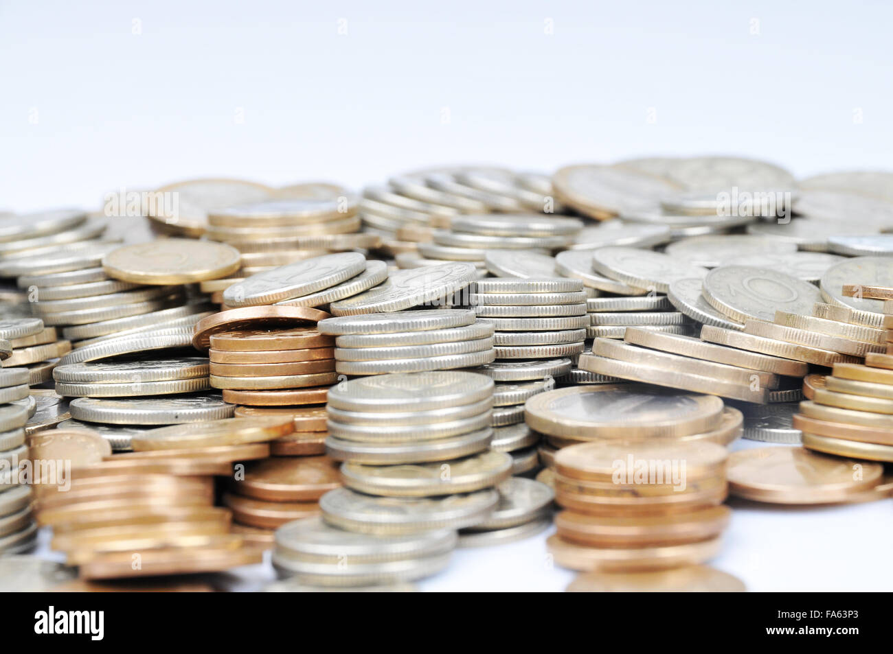 Coins stacked on each other in different positions,Man hand in business ...