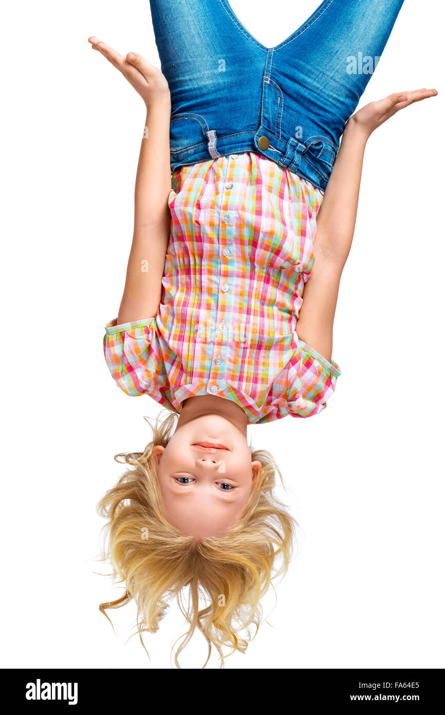 Beautiful little girl hanging upside down Stock Photo - Alamy