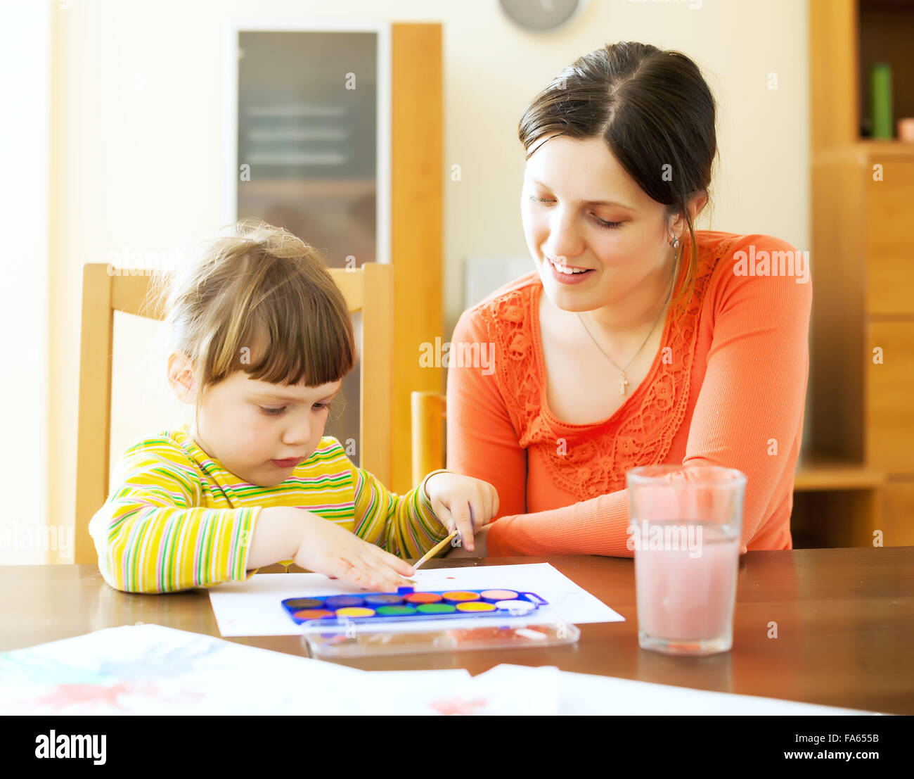 Happy mother and baby drawing on paper with watercolor Stock Photo - Alamy