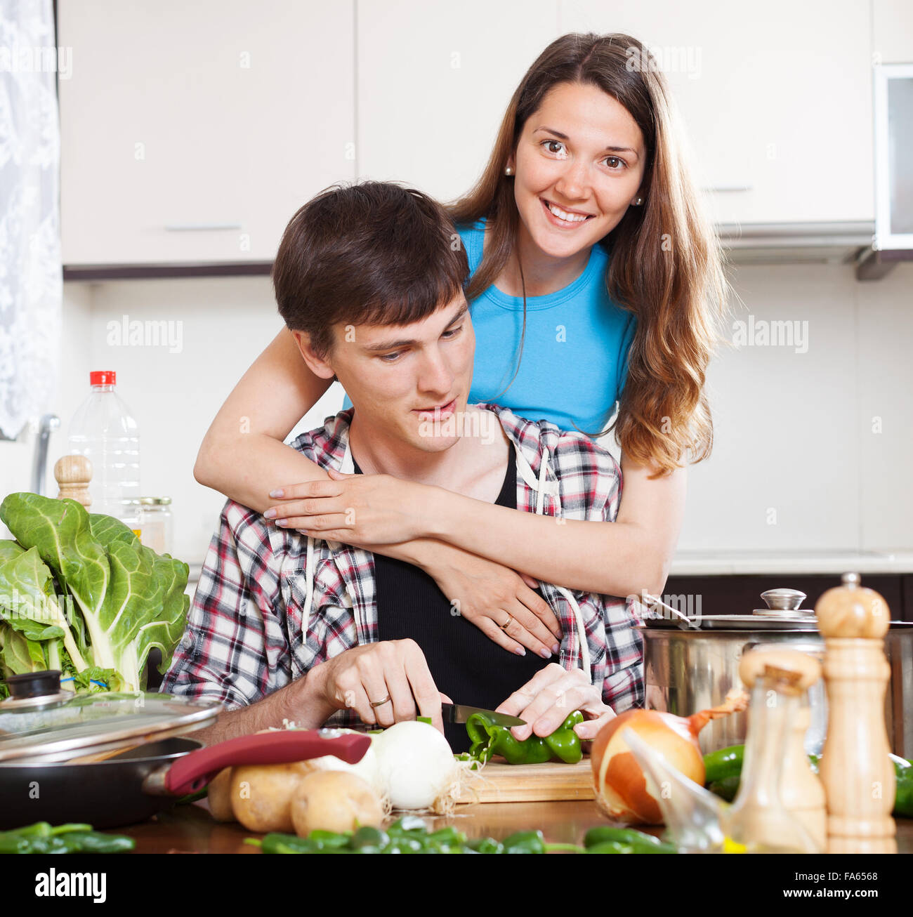 Happy loving couple cooking together Stock Photo - Alamy