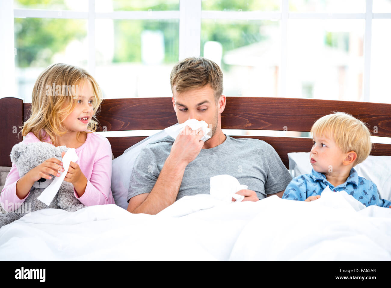 Young family having flue or allergy Stock Photo - Alamy