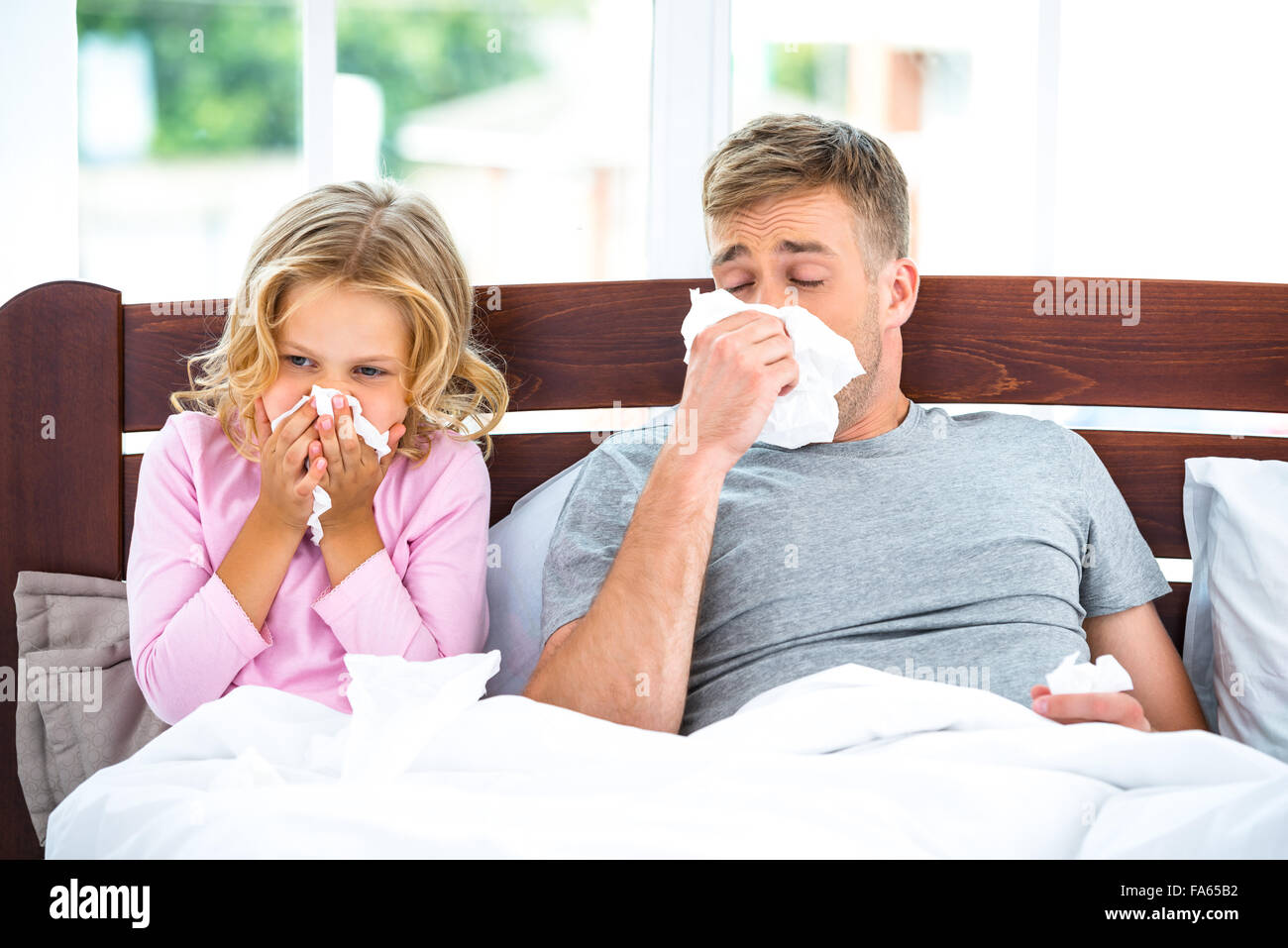Young family having flue or allergy Stock Photo - Alamy