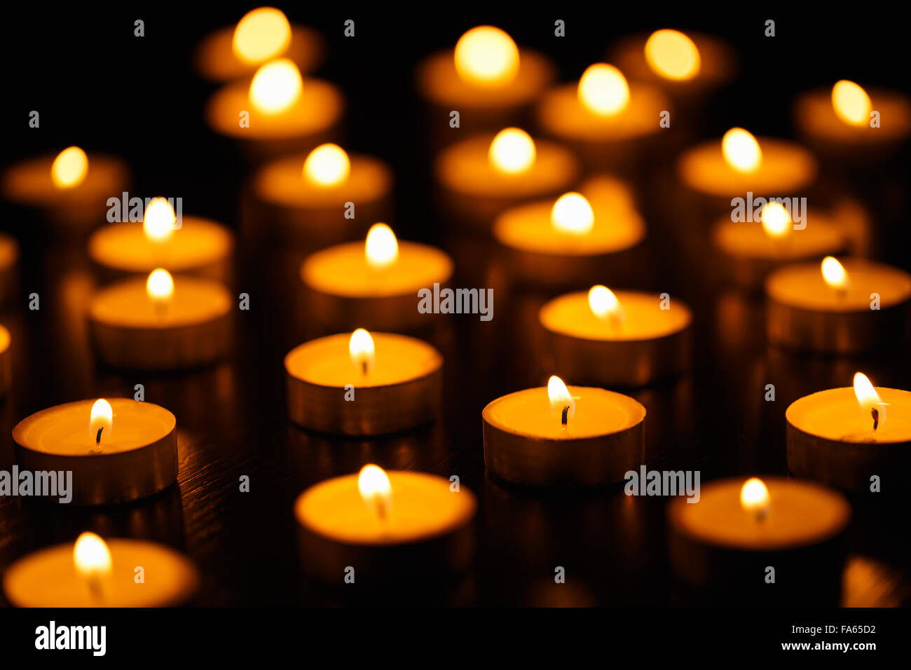 Many burning candles with shallow depth of field Stock Photo - Alamy