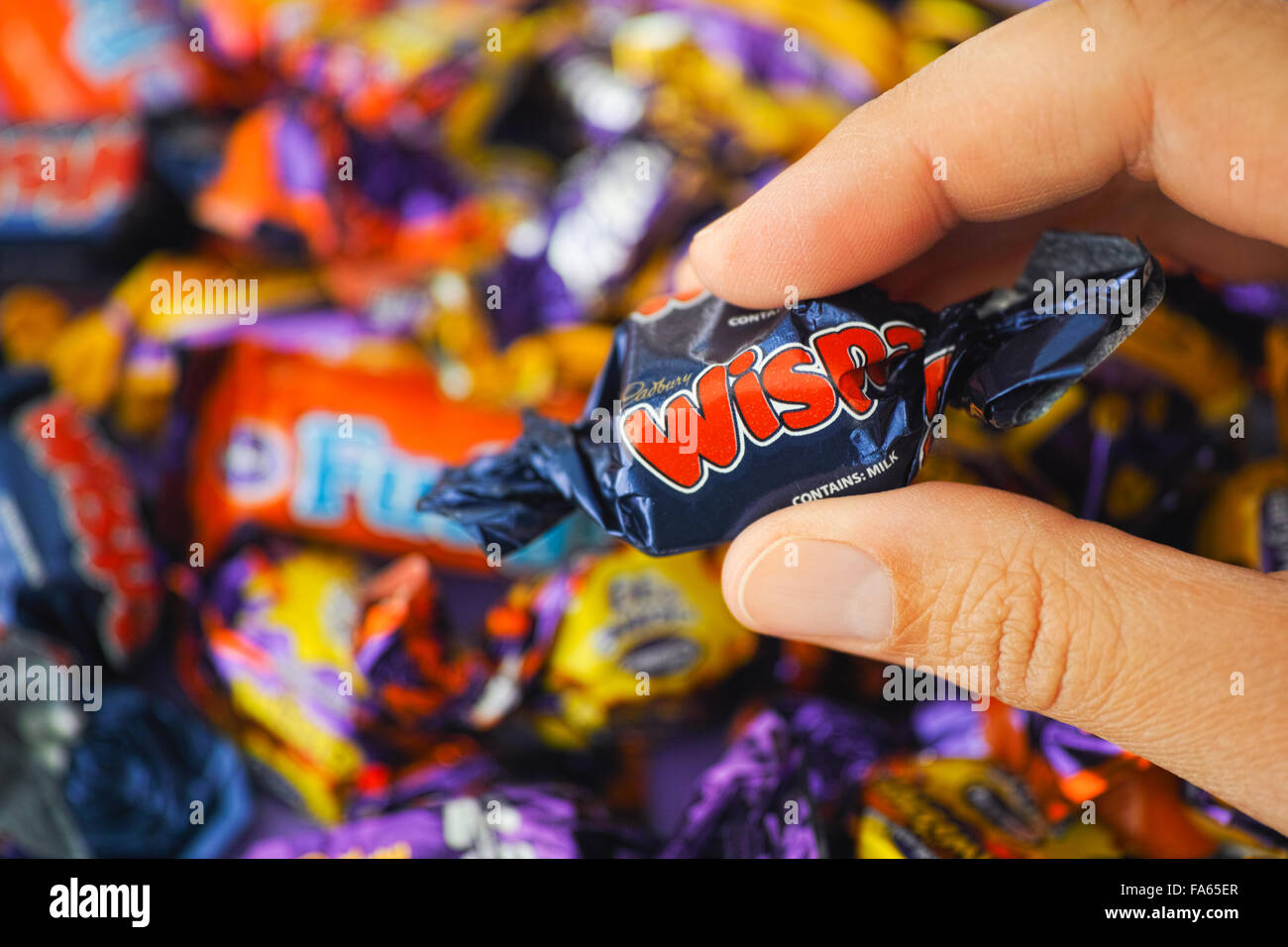 Paphos, Cyprus - November 27, 2015 Cadbury Wispa candy in womans hand ...