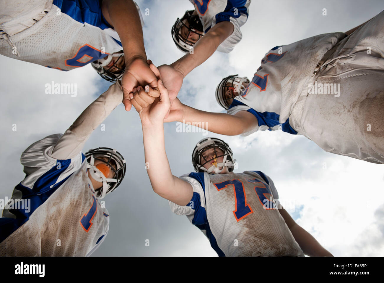 A group of football players, young people in sports uniform and ...