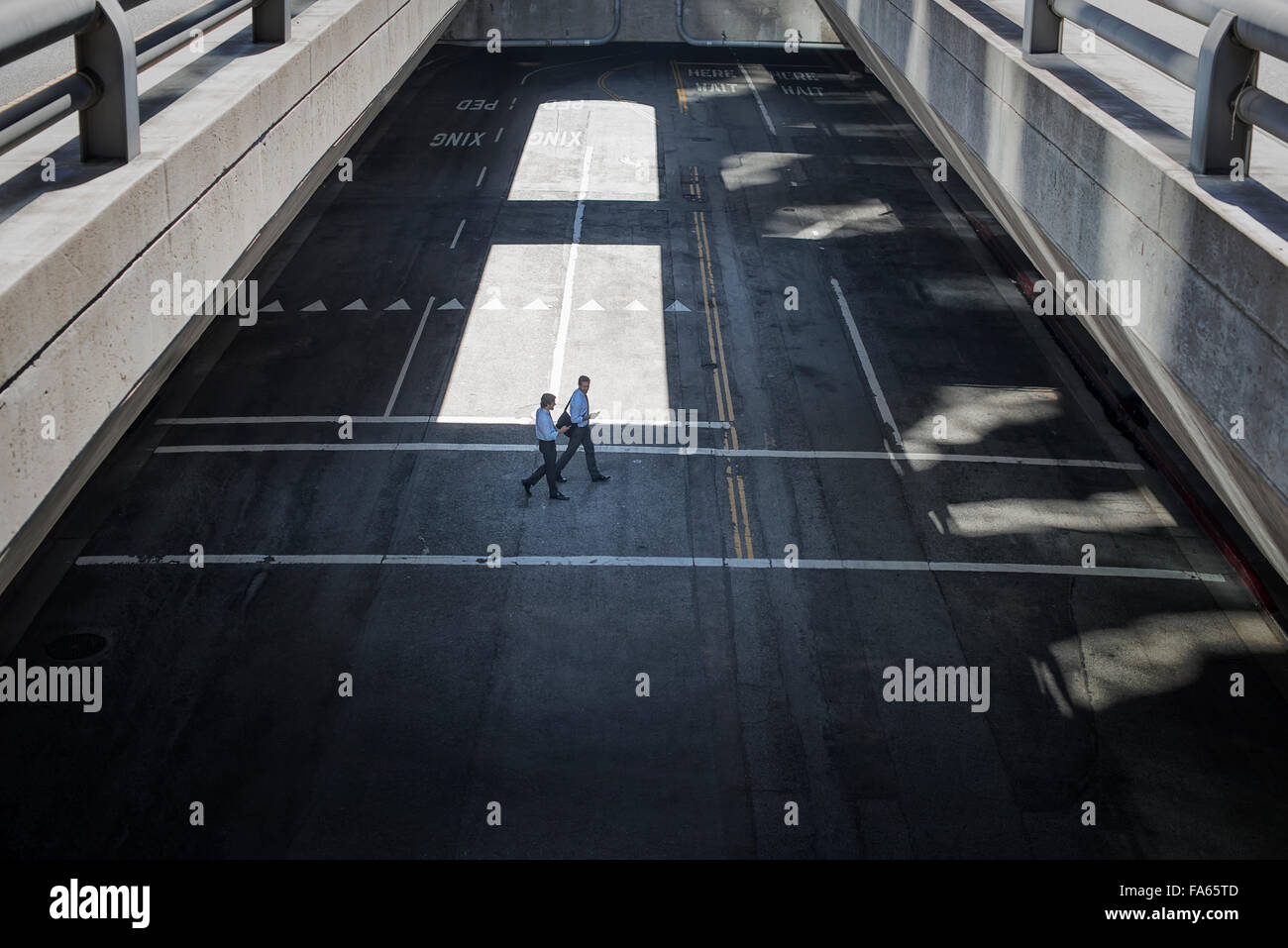 Two men walking hi-res stock photography and images - Alamy