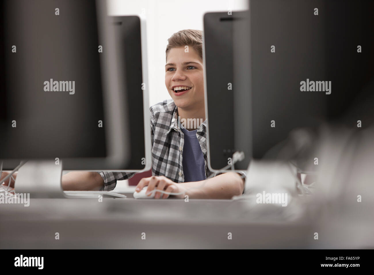 A school room computer laboratory or lab with rows of computer monitors ...