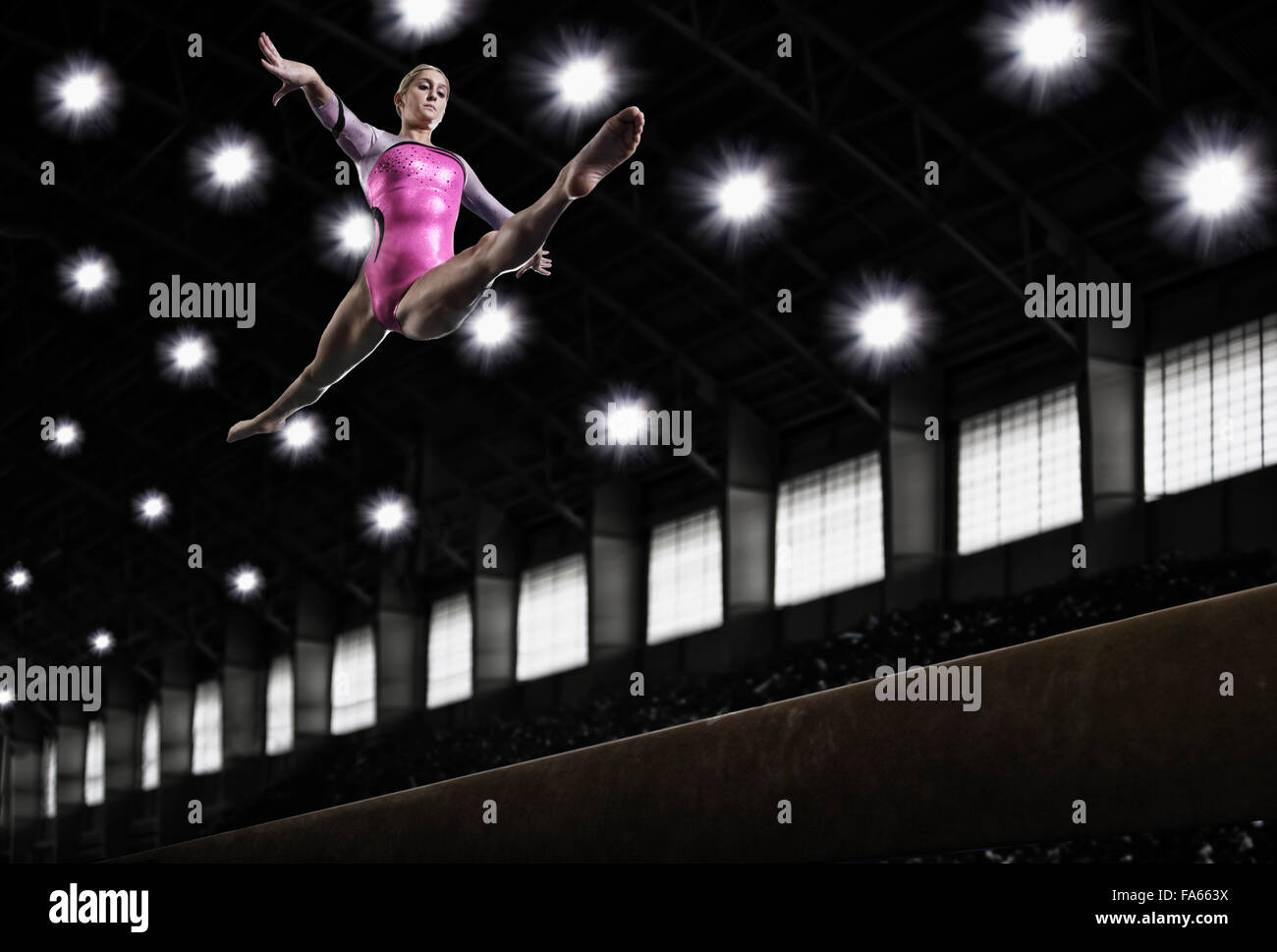 Gymnast jumping on beam hi-res stock photography and images - Alamy